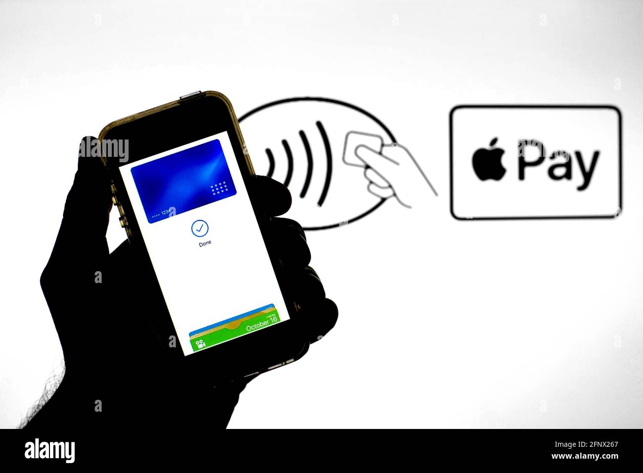 In this photo illustration an Apple Pay app seen displayed on a ...