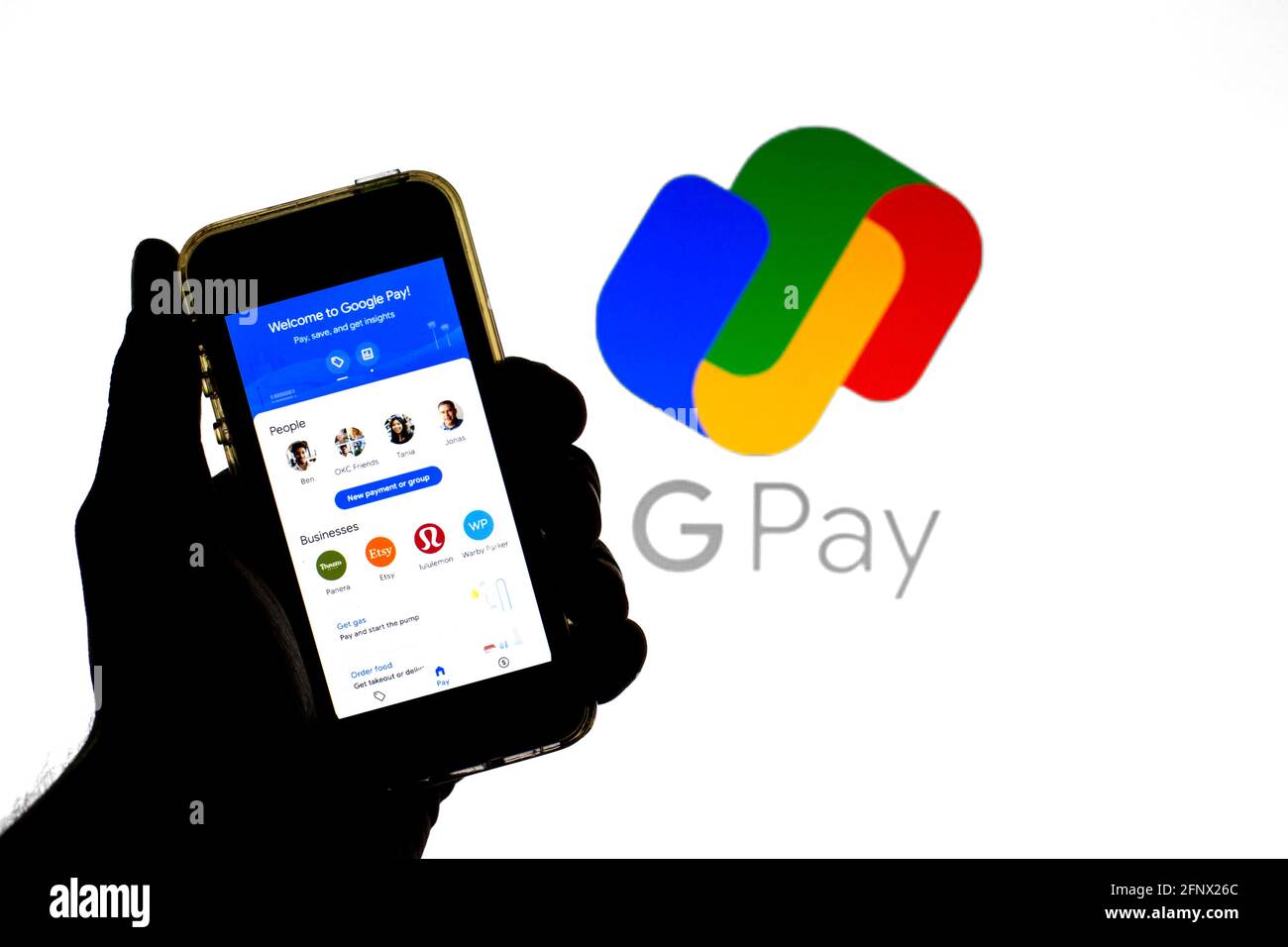 In this photo illustration a Google Pay app seen displayed on a ...