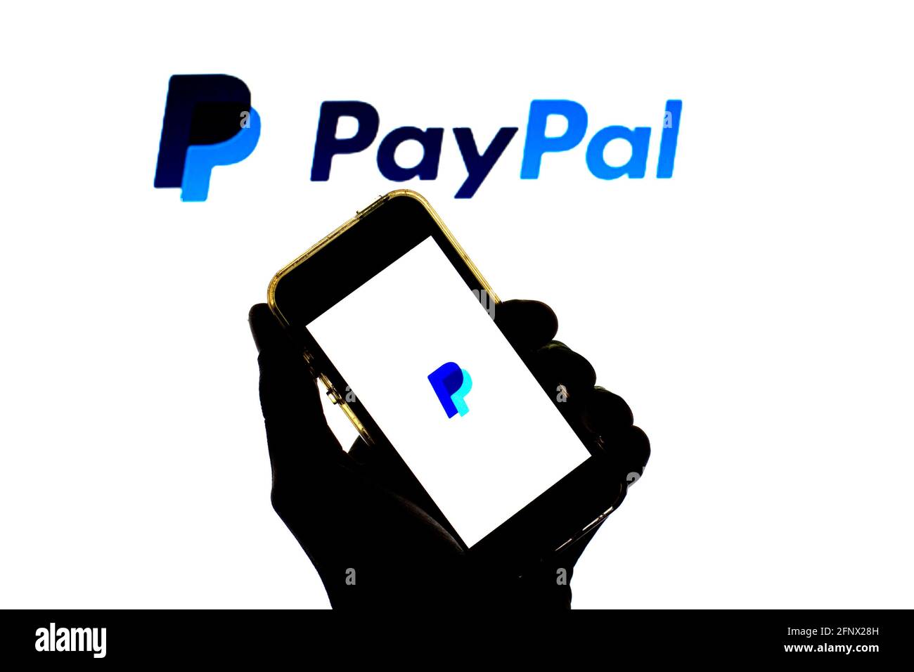 In this photo illustration a PayPal app seen displayed on a smartphone ...