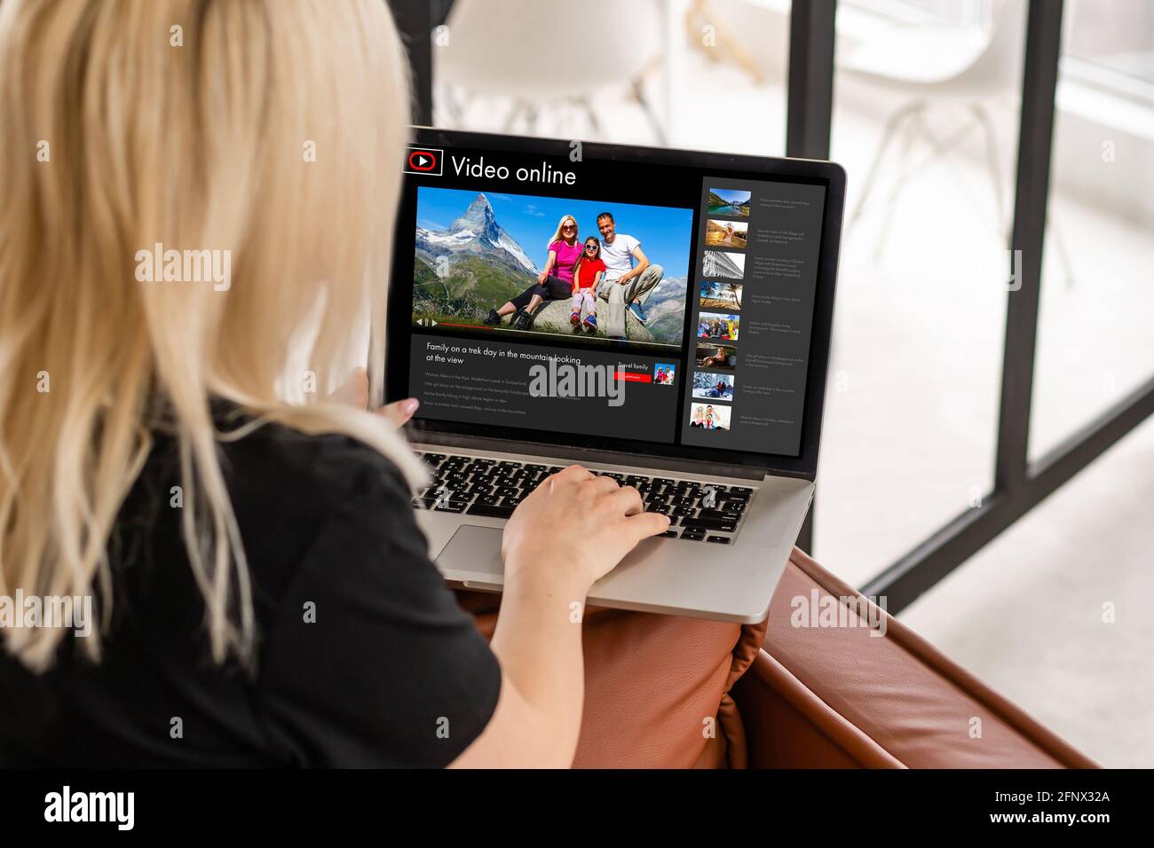 Watching youtube video on laptop hi-res stock photography and images ...