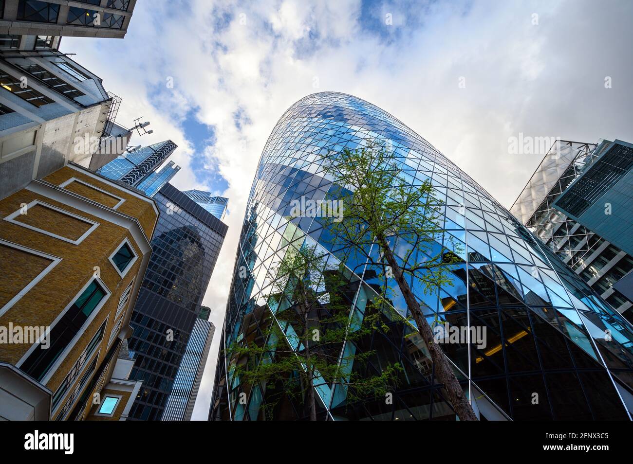 London, UK: Looking up at the Gherkin building in the City of London ...
