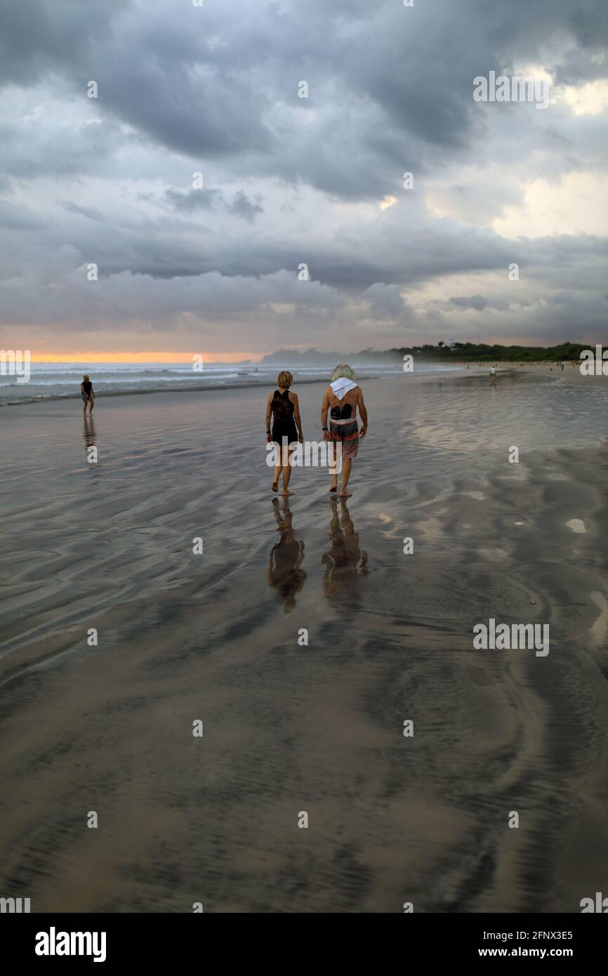 Older Couple Walking on Beach Stock Photo - Alamy