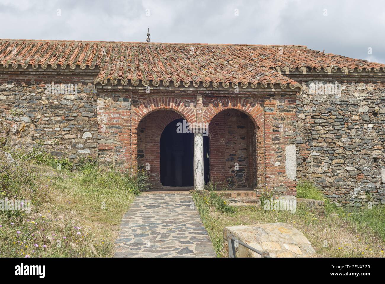 Castillo de Almonaster la Real under a cloudy sky in Spain Stock Photo ...