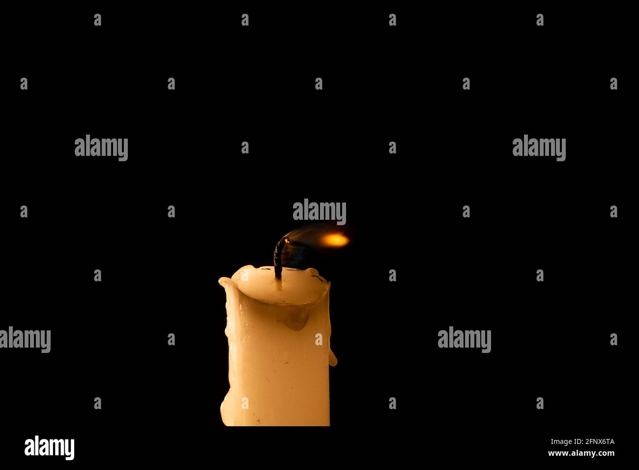 Candle extinguishing on black background Stock Photo - Alamy
