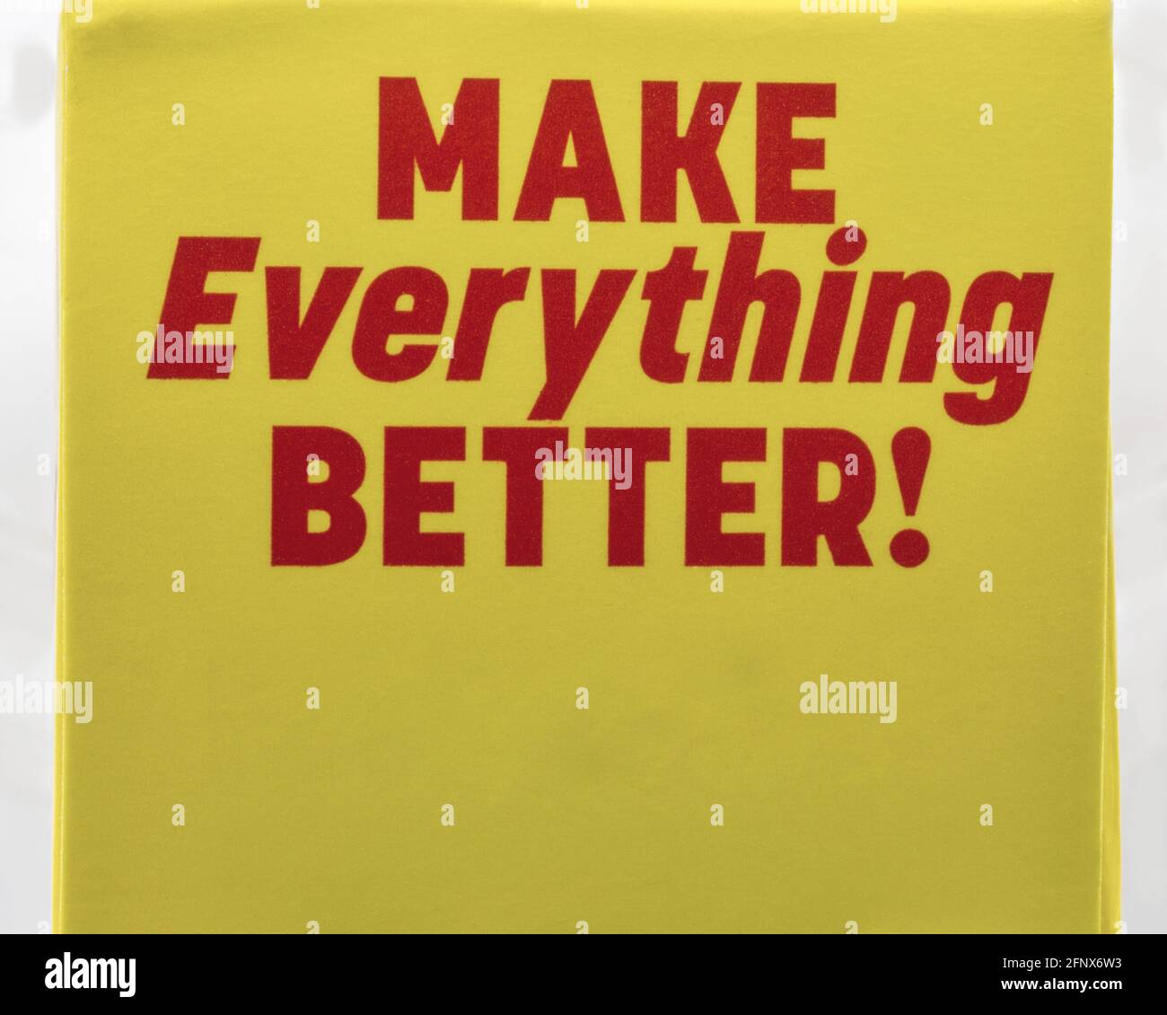 Red positive sign Make Everything Better closeup on yellow background ...