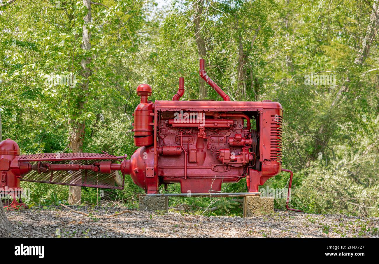 a bright red farm tractor engine Stock Photo - Alamy