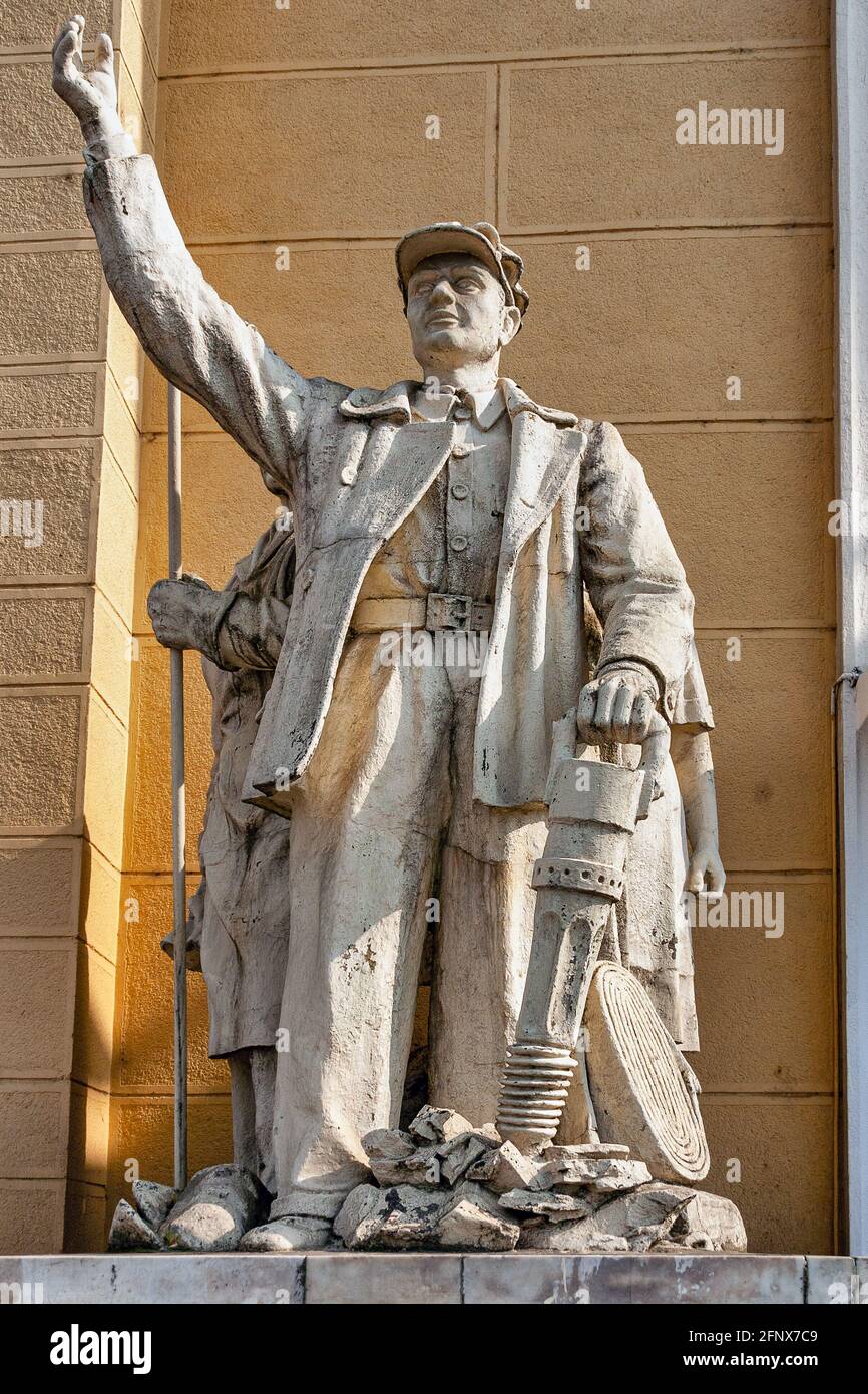 The old Soviet statue of woman and worker. Sculptures of the ...
