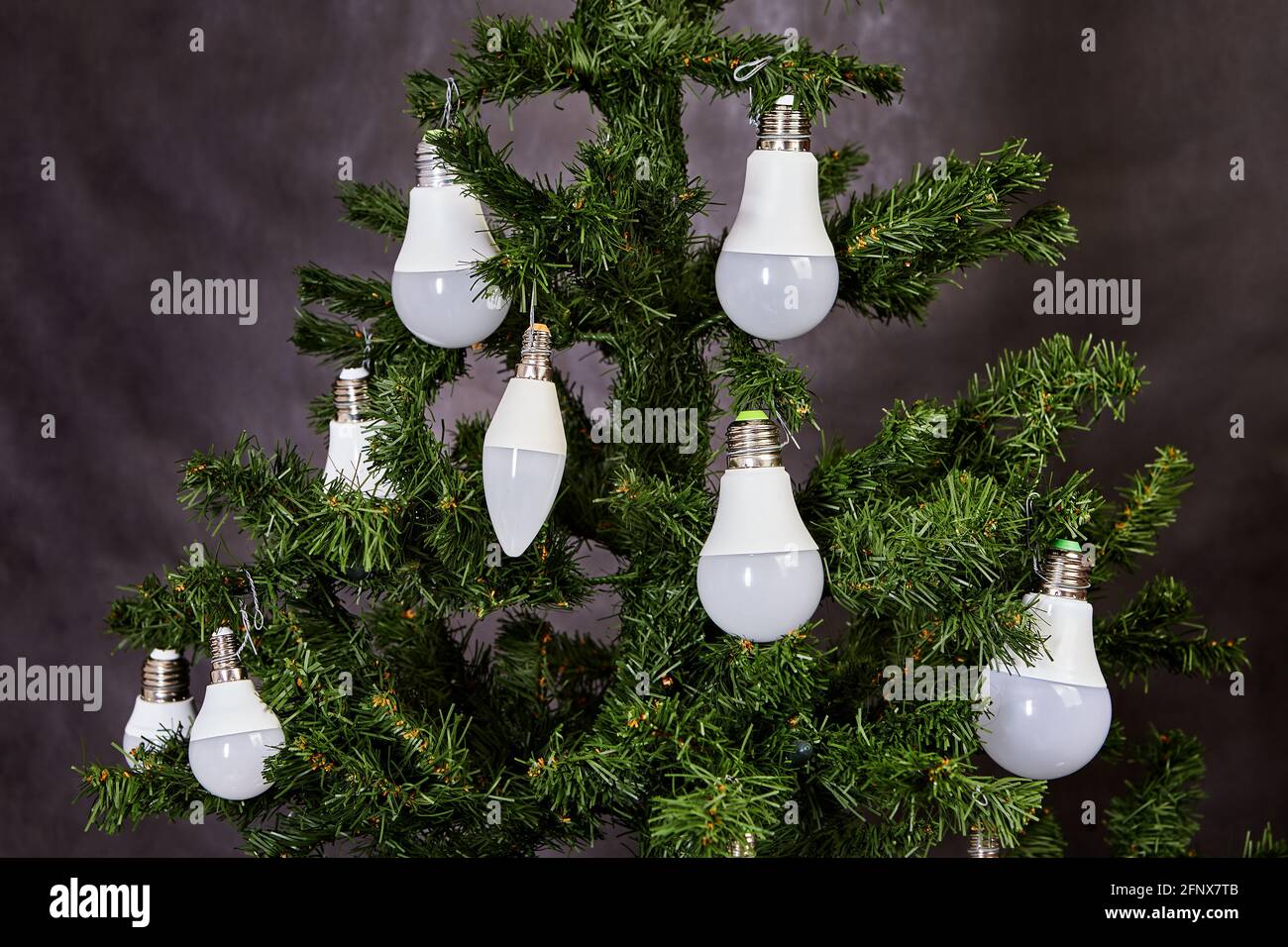 Plastic Christmas tree decorated with LED lights Stock Photo - Alamy