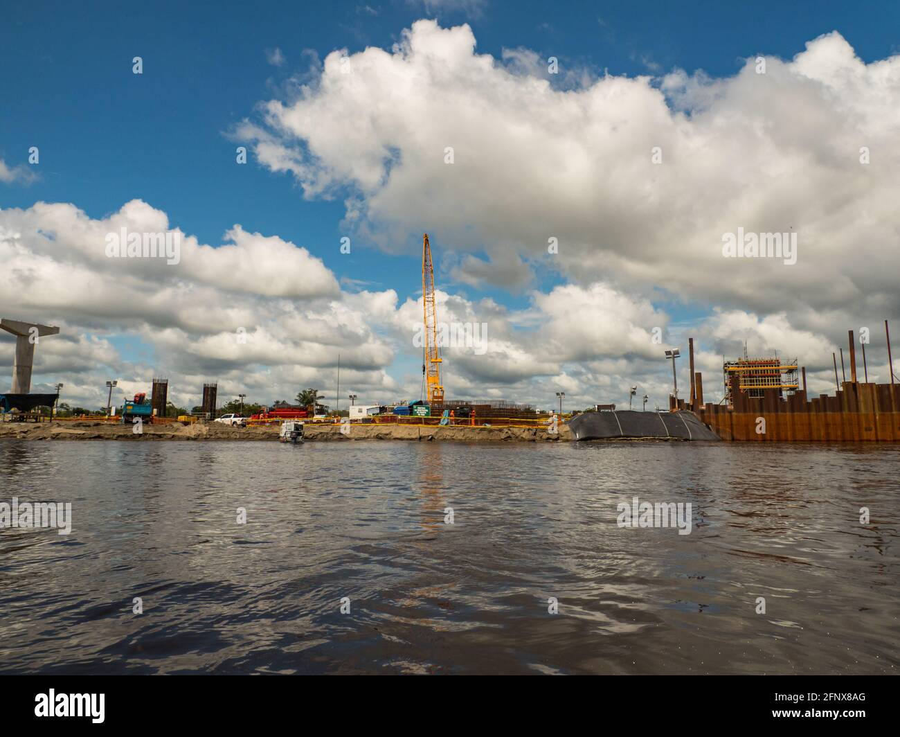 Iquitos, Peru - Dec 2019: Construction of a bridge over the river Nanay ...