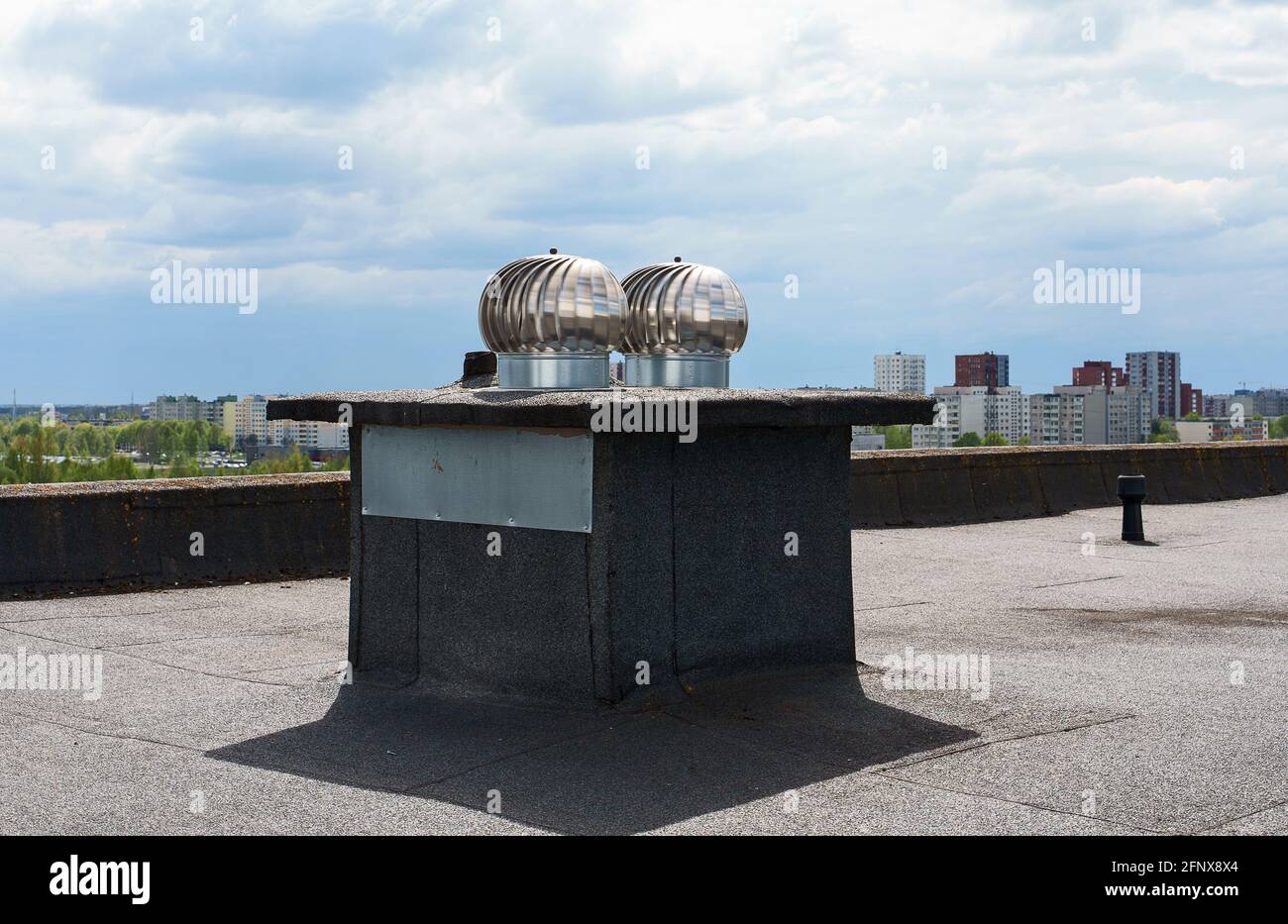 Rotary deflectors on the apartment house rooftop Stock Photo - Alamy