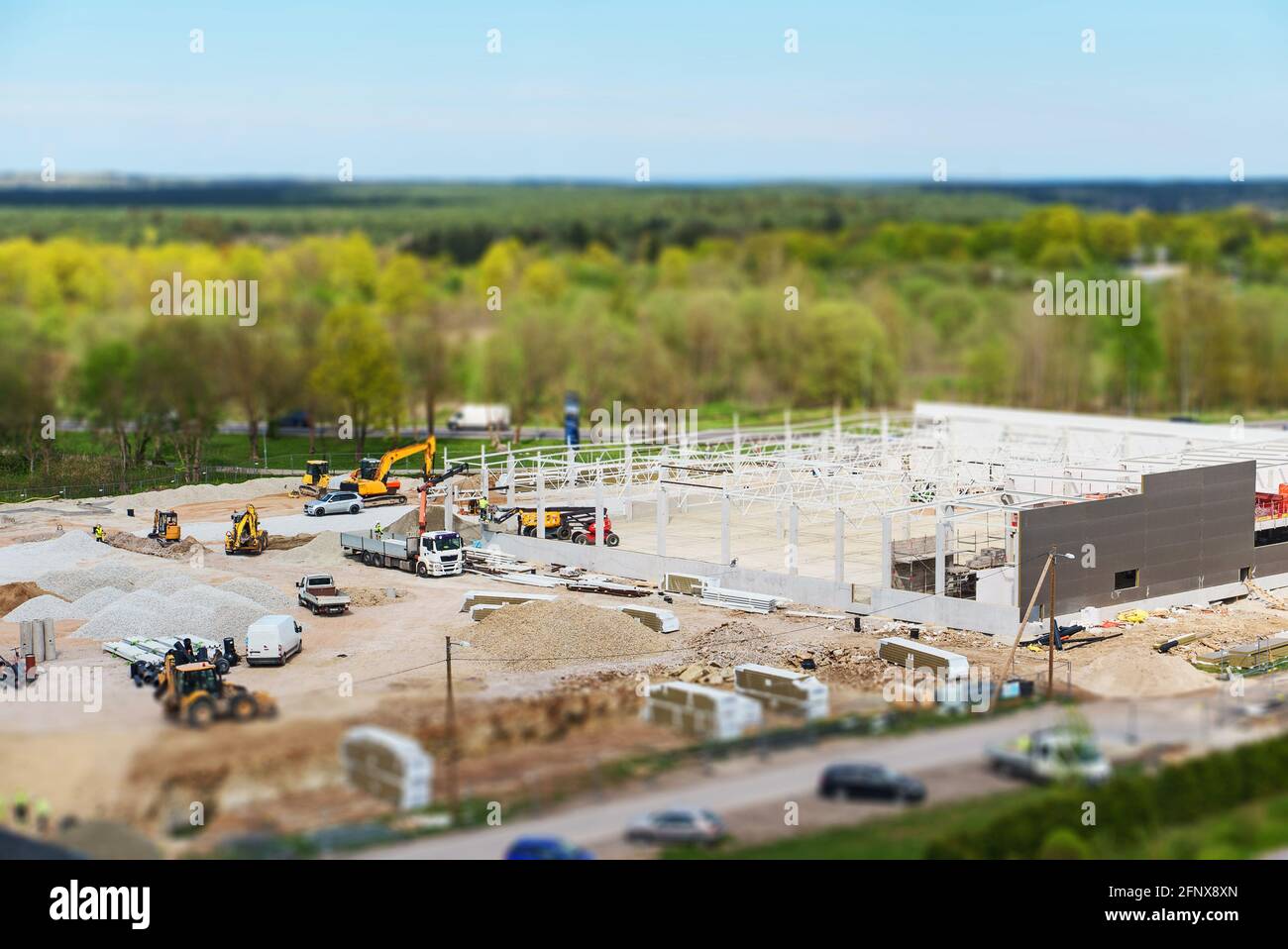 Construction site with heavy equipment. Tilt-shift effect Stock Photo ...