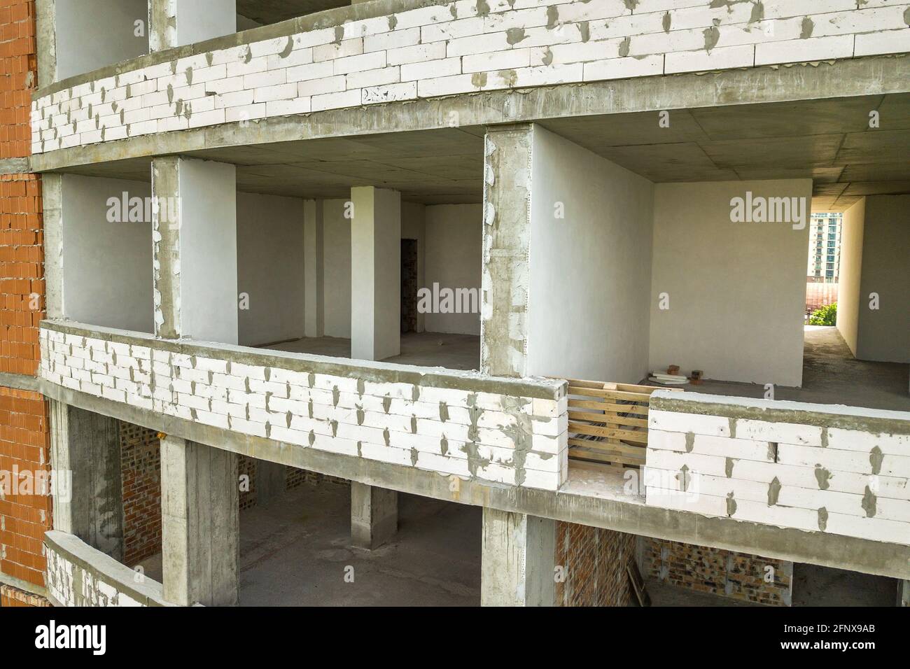 Rooms interior of new apartment building facade under construction ...