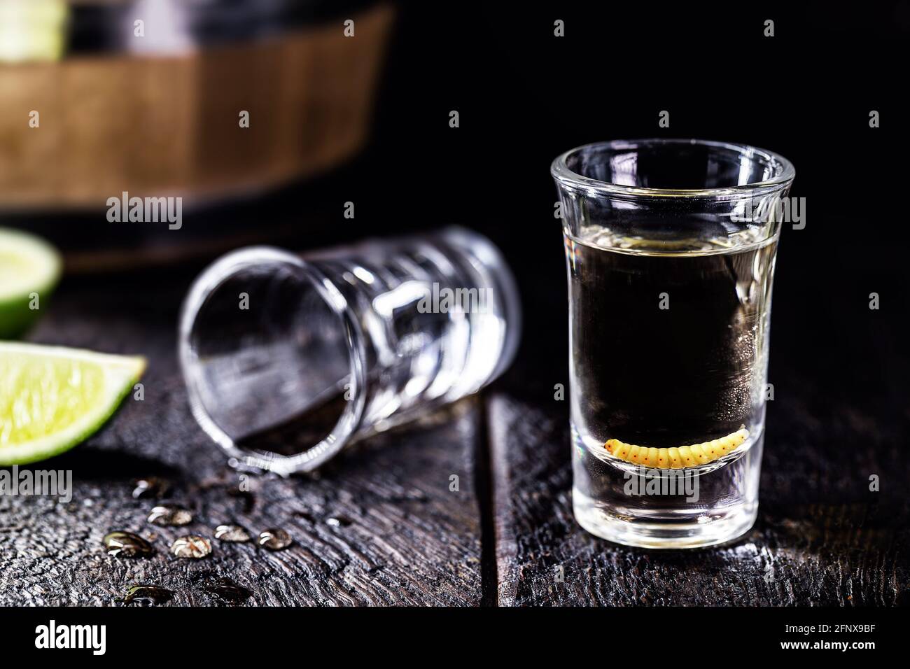 several glasses with mezcal (or mescal) is commonly known as tequila ...