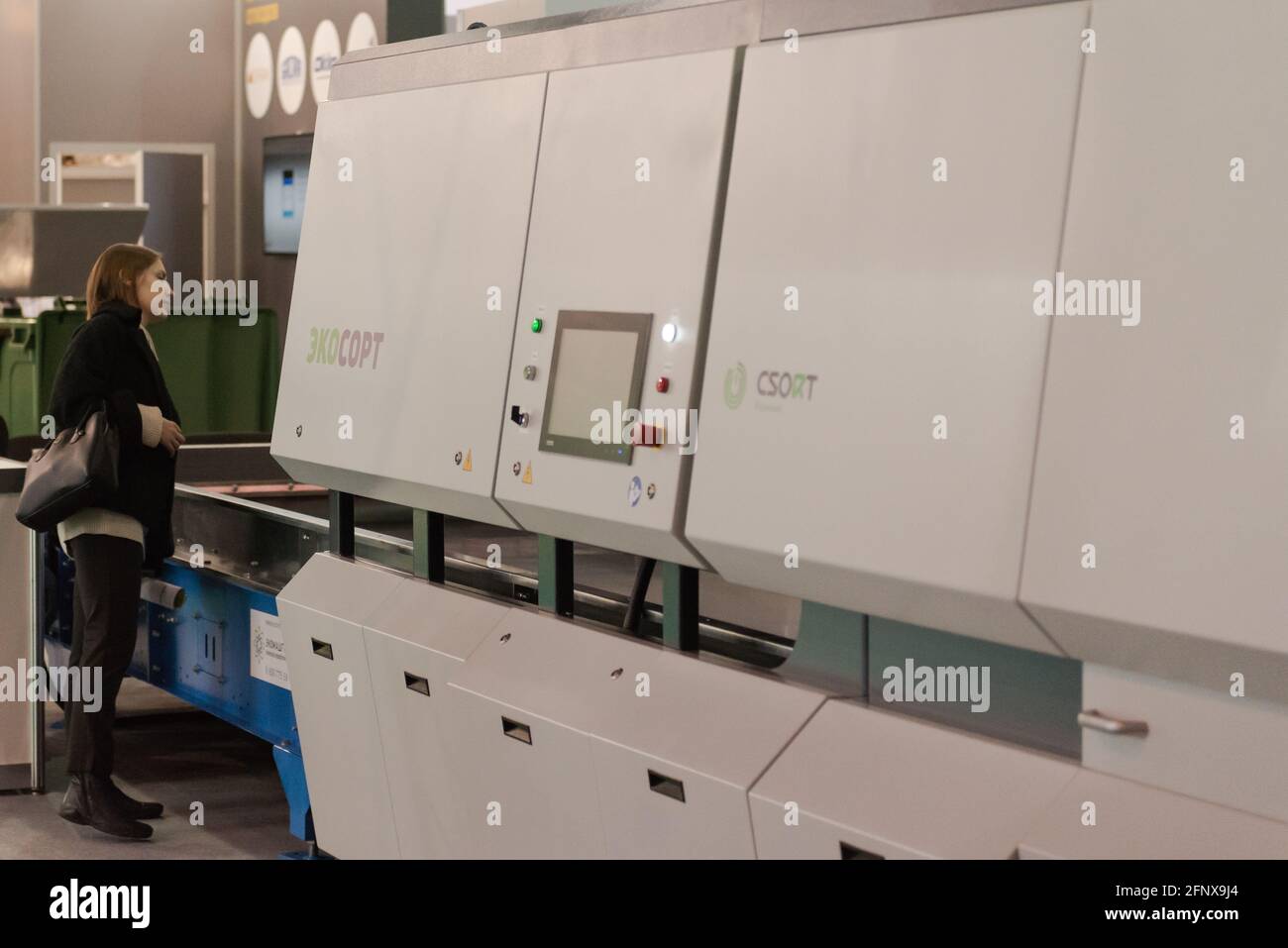 Moscow. Russia. Autumn 2019. Automatic garbage sorting machine. A woman ...