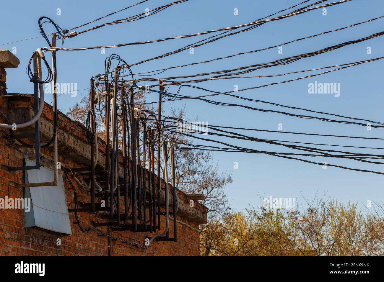 lots of wires sticking out of an old brick electrical substation ...