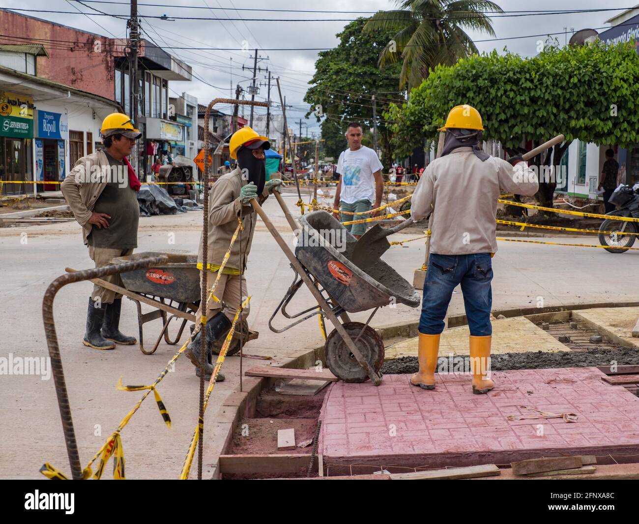 Leticia, Colombia - Dec 2019: Workers in helmets during the ...