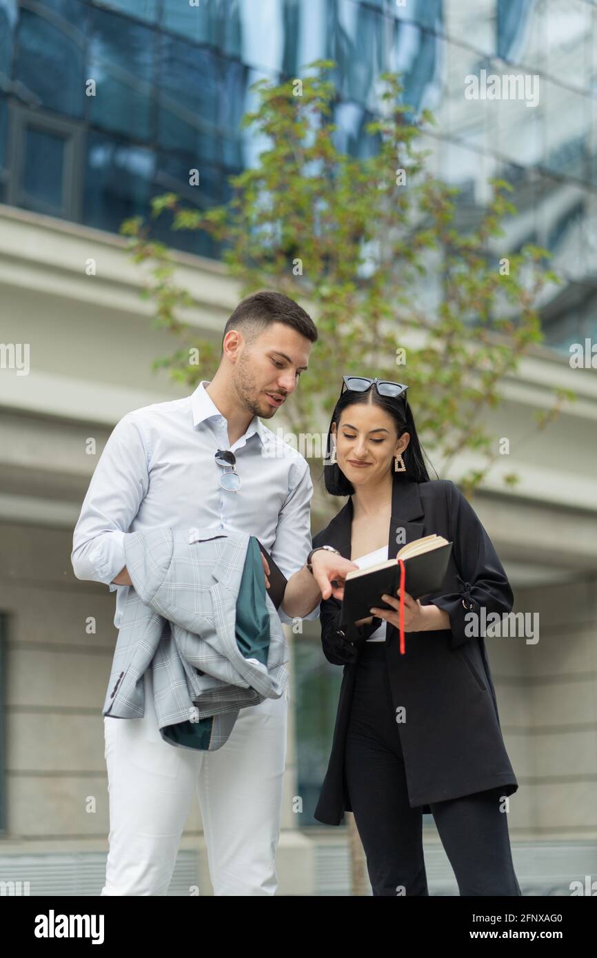 Two business people are having a conversation about their company Stock ...