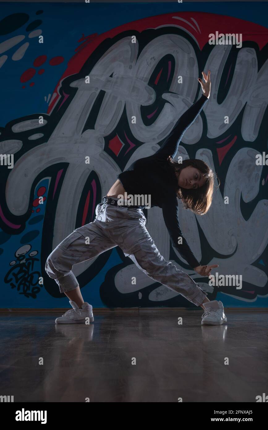 Silhouette of young woman hiphop dancer (breakdancer)dancing on ...