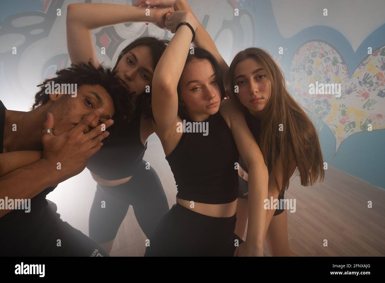 Group of multiracial dancers are exercising and practicing in their ...