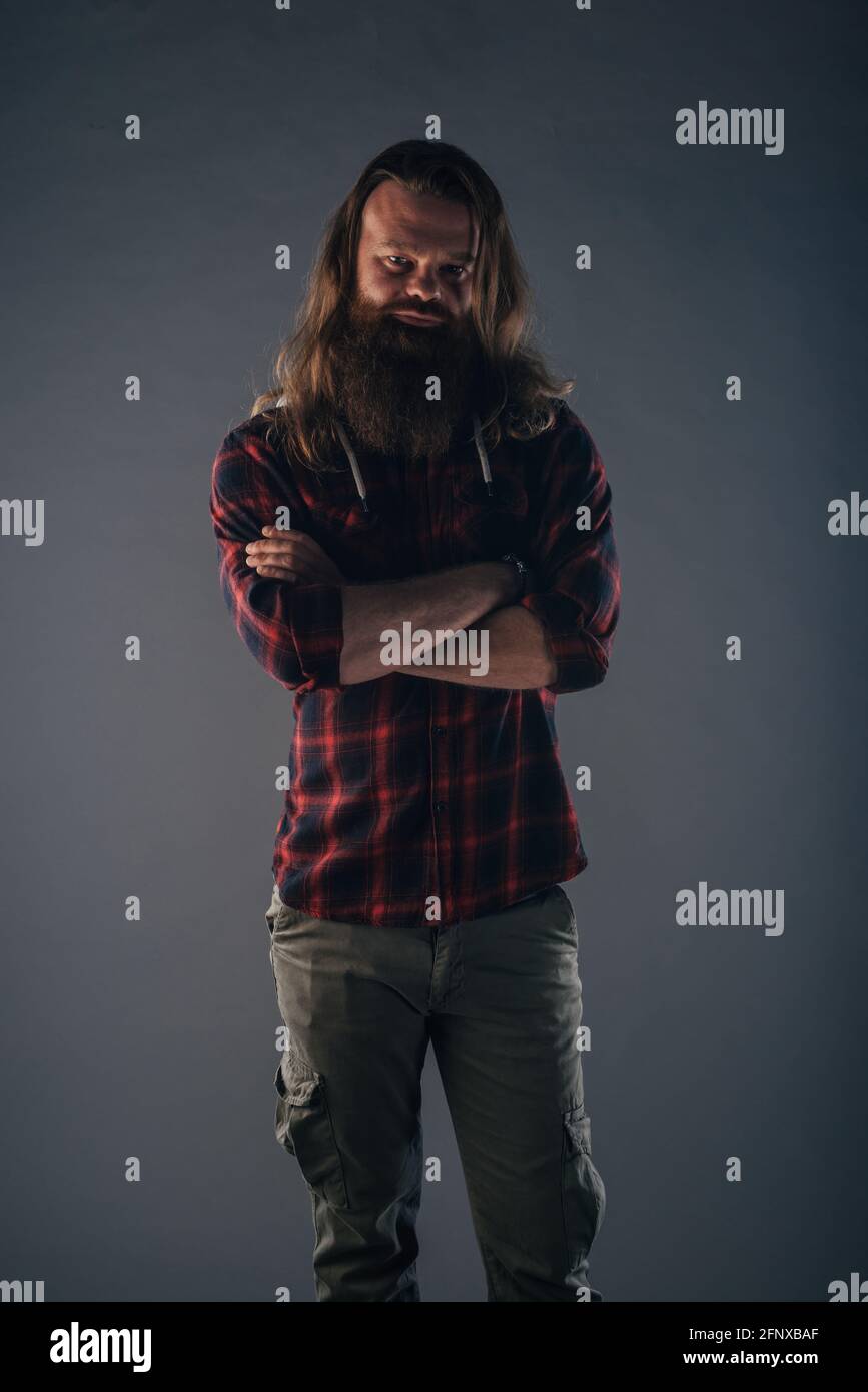 Beautiful strong nordic man with stylish hairstyle and beard on a ...