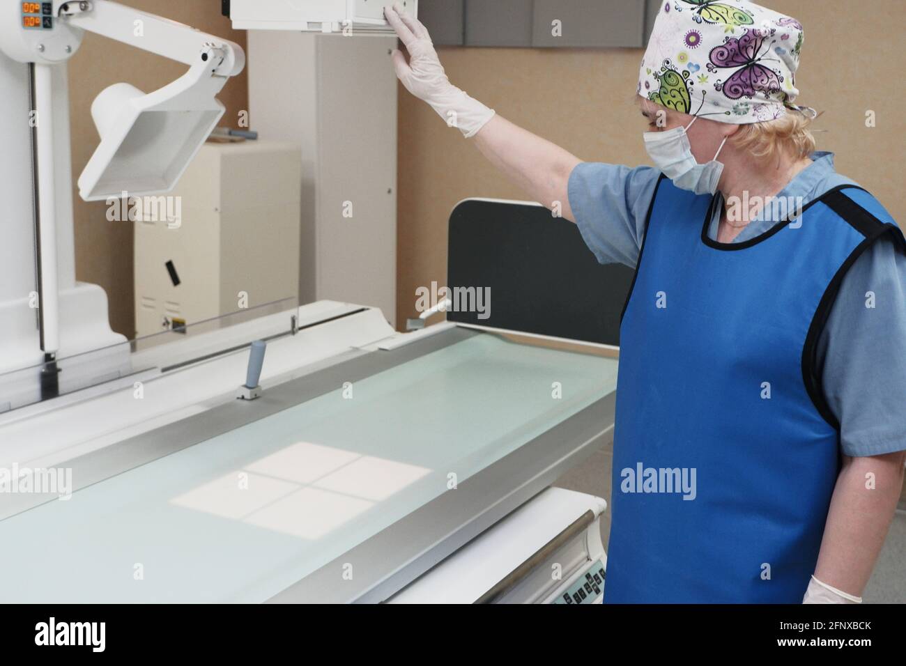 The work of a radiologist in the X-ray room for diagnostics Stock Photo ...