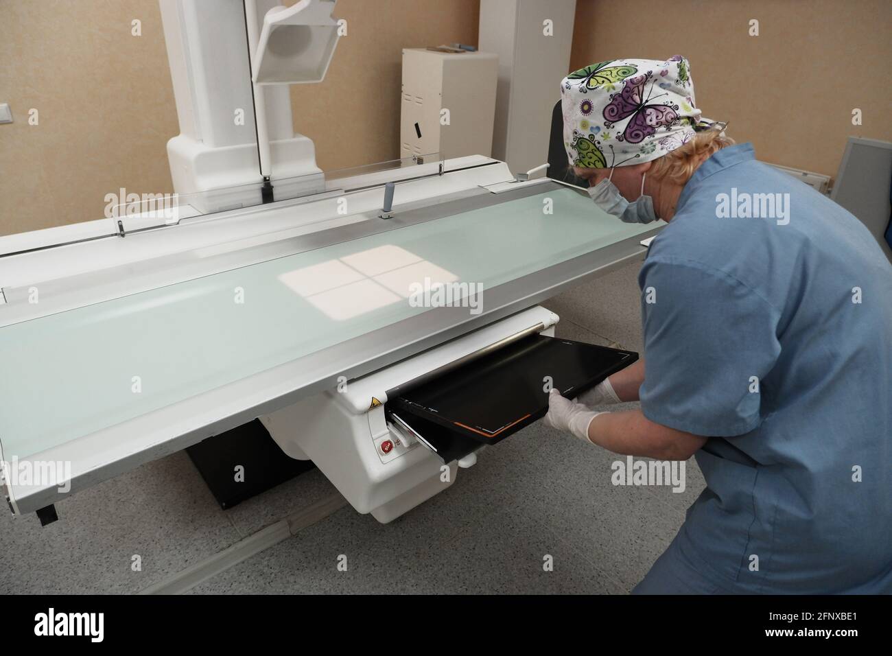 The work of a radiologist in the X-ray room for diagnostics Stock Photo ...