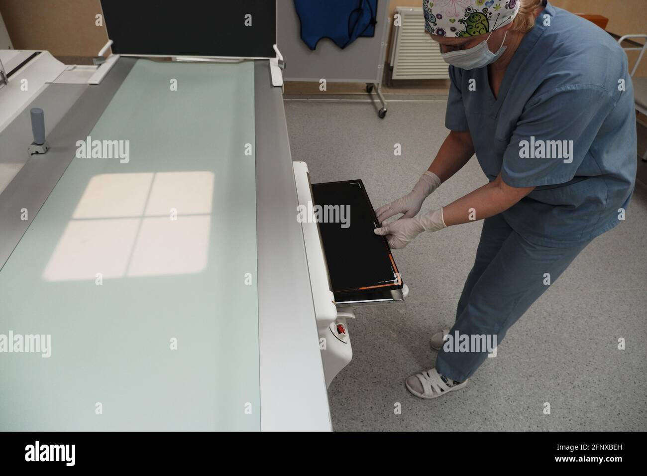 The work of a radiologist in the X-ray room for diagnostics Stock Photo ...