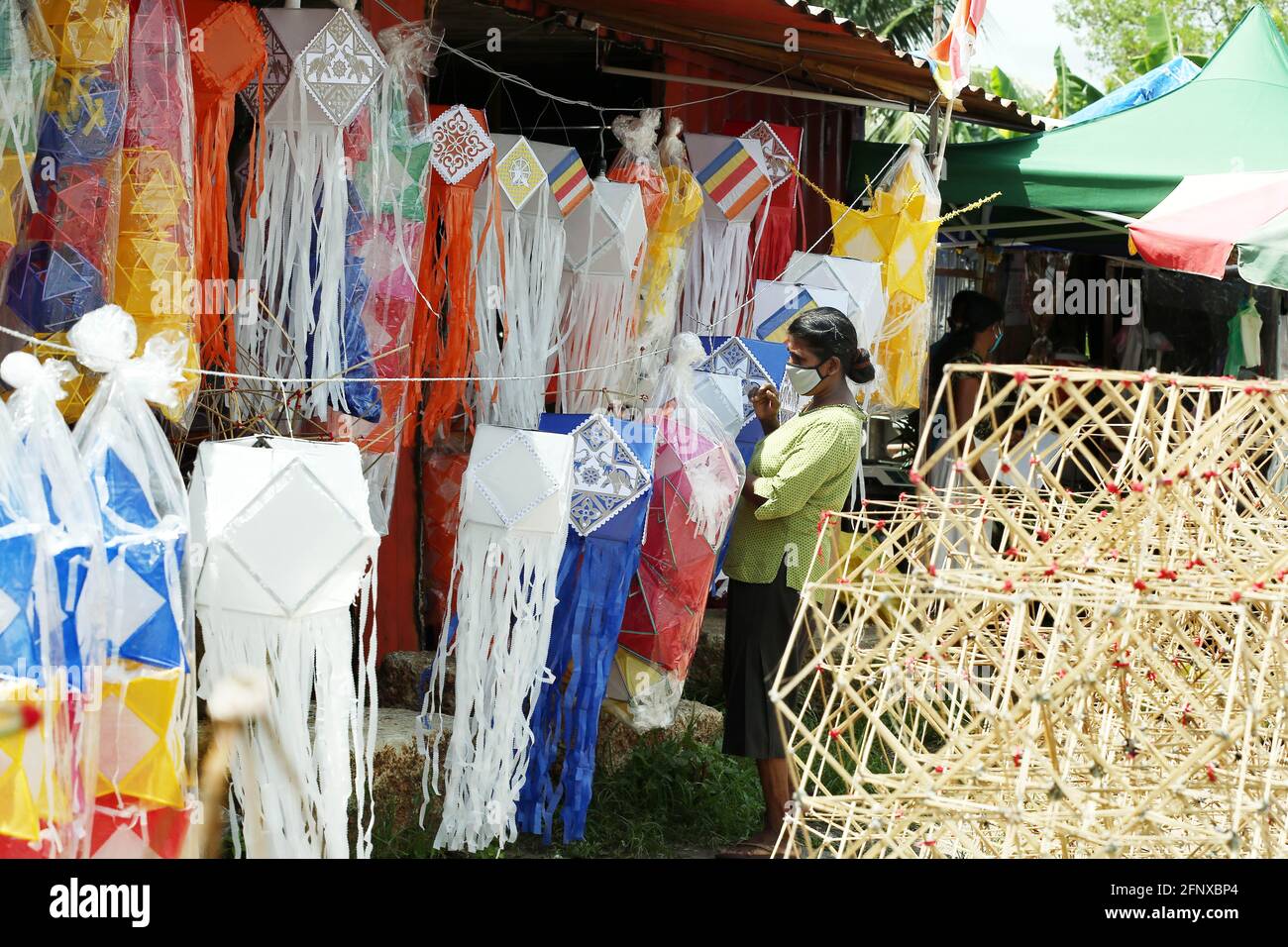 Colombo, Sri Lanka. 19th May, 2021. A vendor wearing a face mask ...