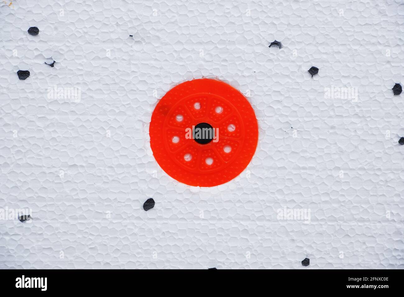 Wall insulation made of pinoplast. Texture with black splashes and red ...