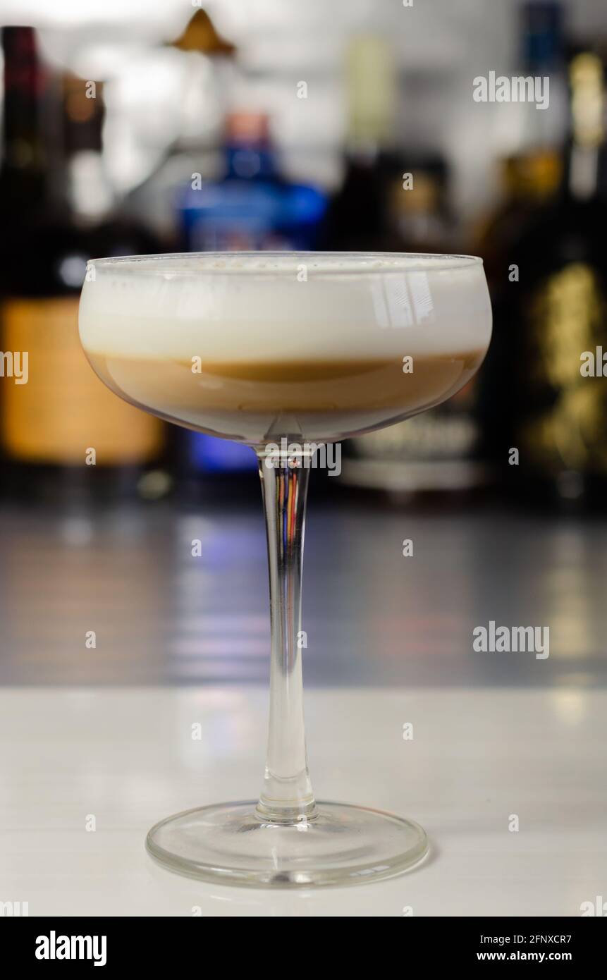 Alcoholic coffee cocktail with a nutty note and fluffy milk foam on the ...