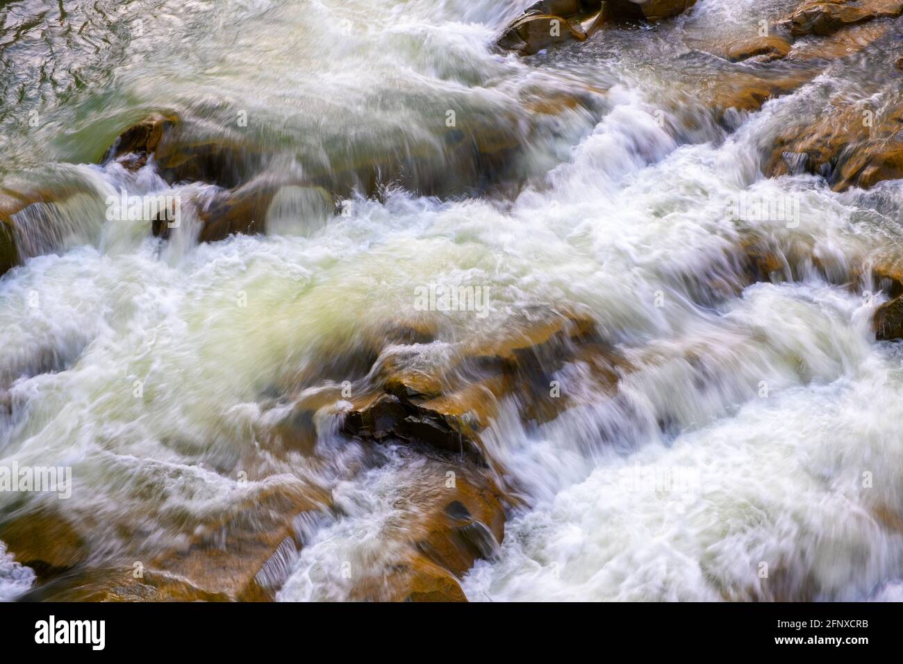 Aerial view of river waterfall with clear turquoise water falling down ...