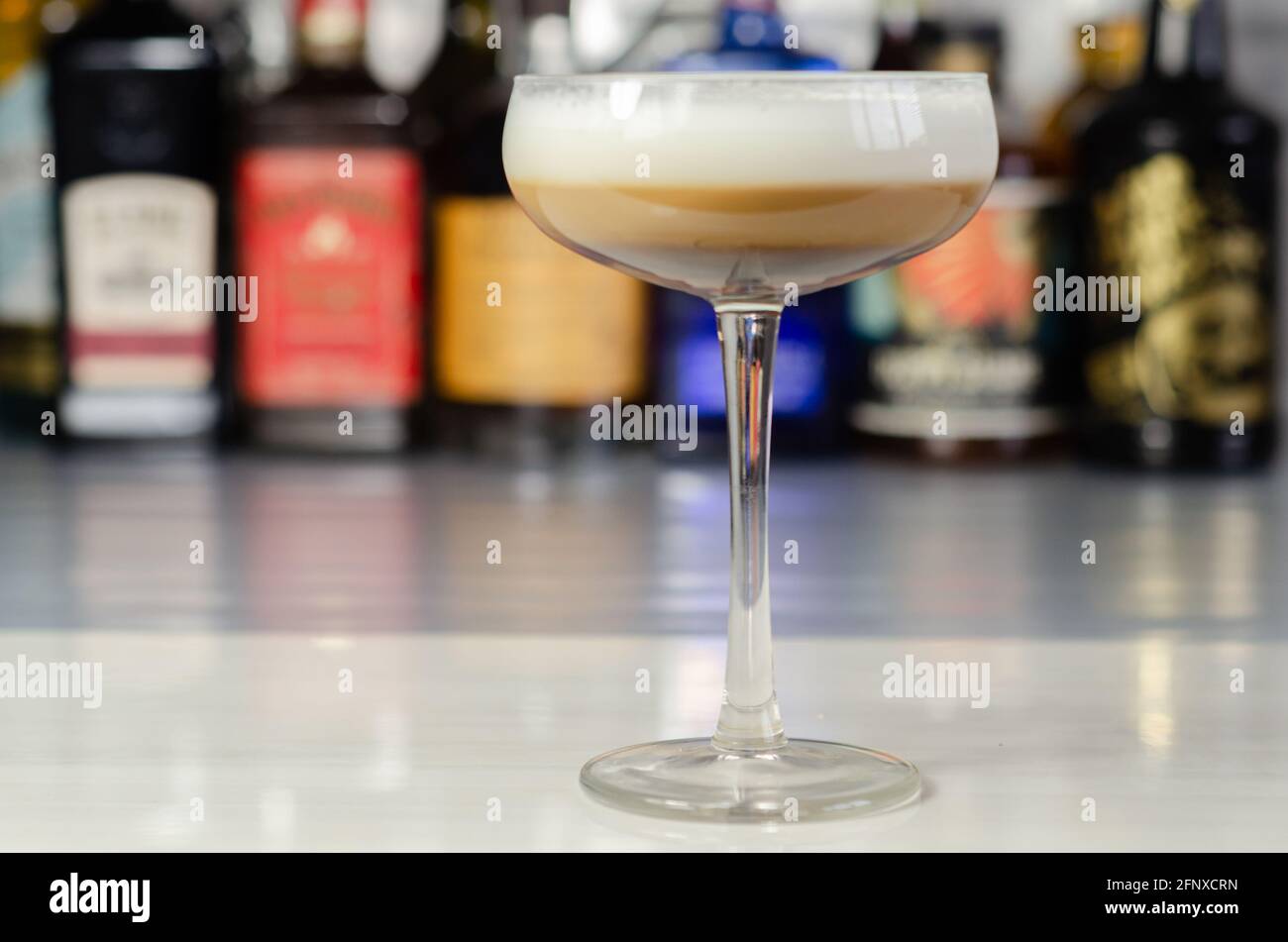 Alcoholic coffee cocktail with a nutty note and fluffy milk foam on the ...
