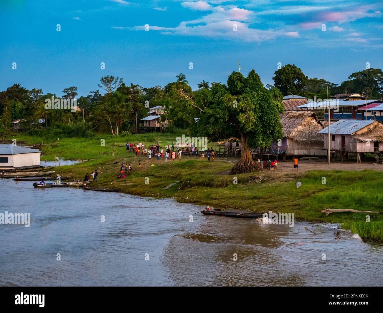Amazon River, Peru - March 25, 2018: Small village on the bank of the ...
