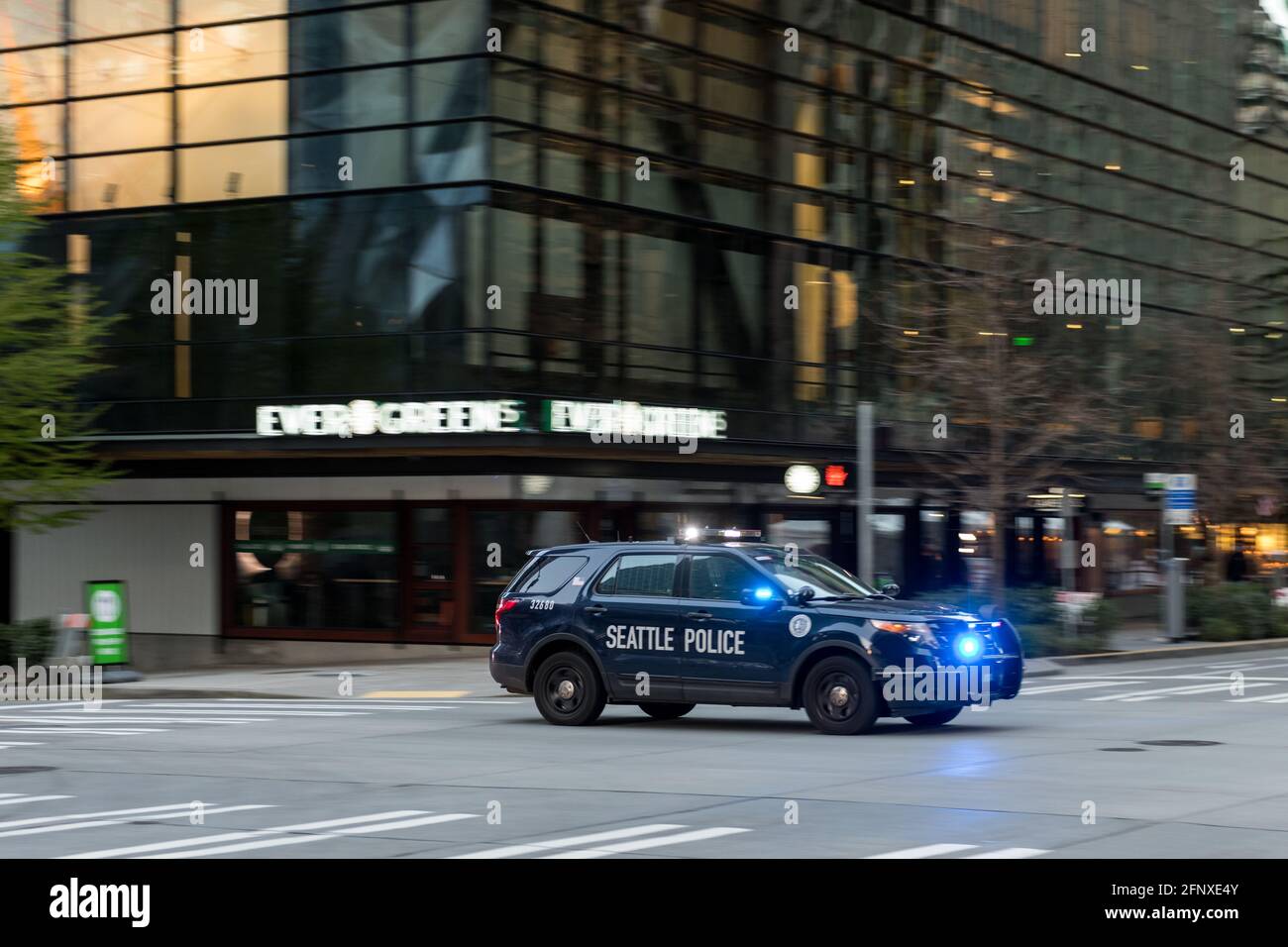 Seattle, USA. 5th Apr, 2021. A police car passing the Amazon campus in ...