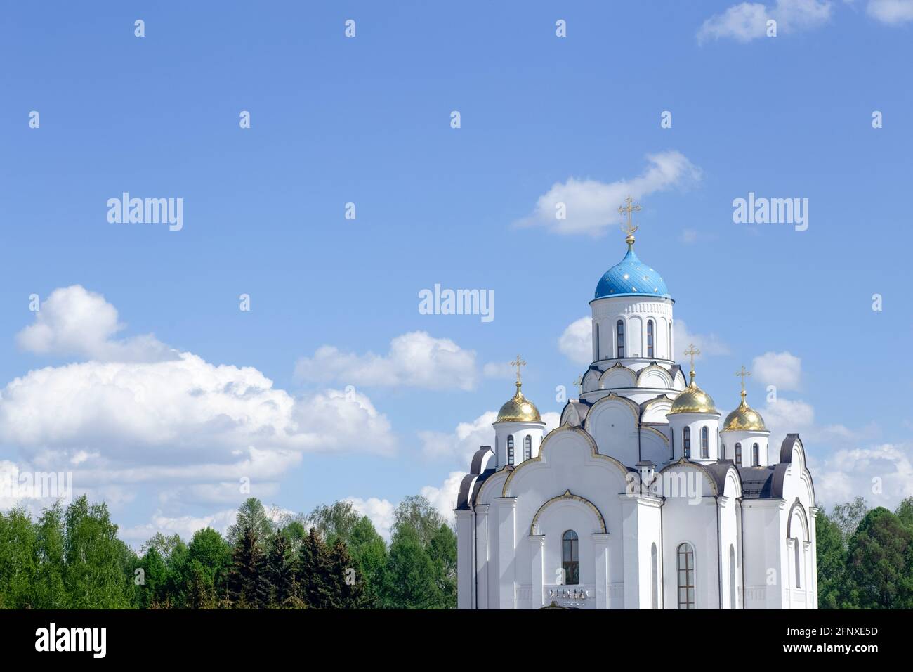 Russian Christian Orthodox church with domes and a cross against the ...