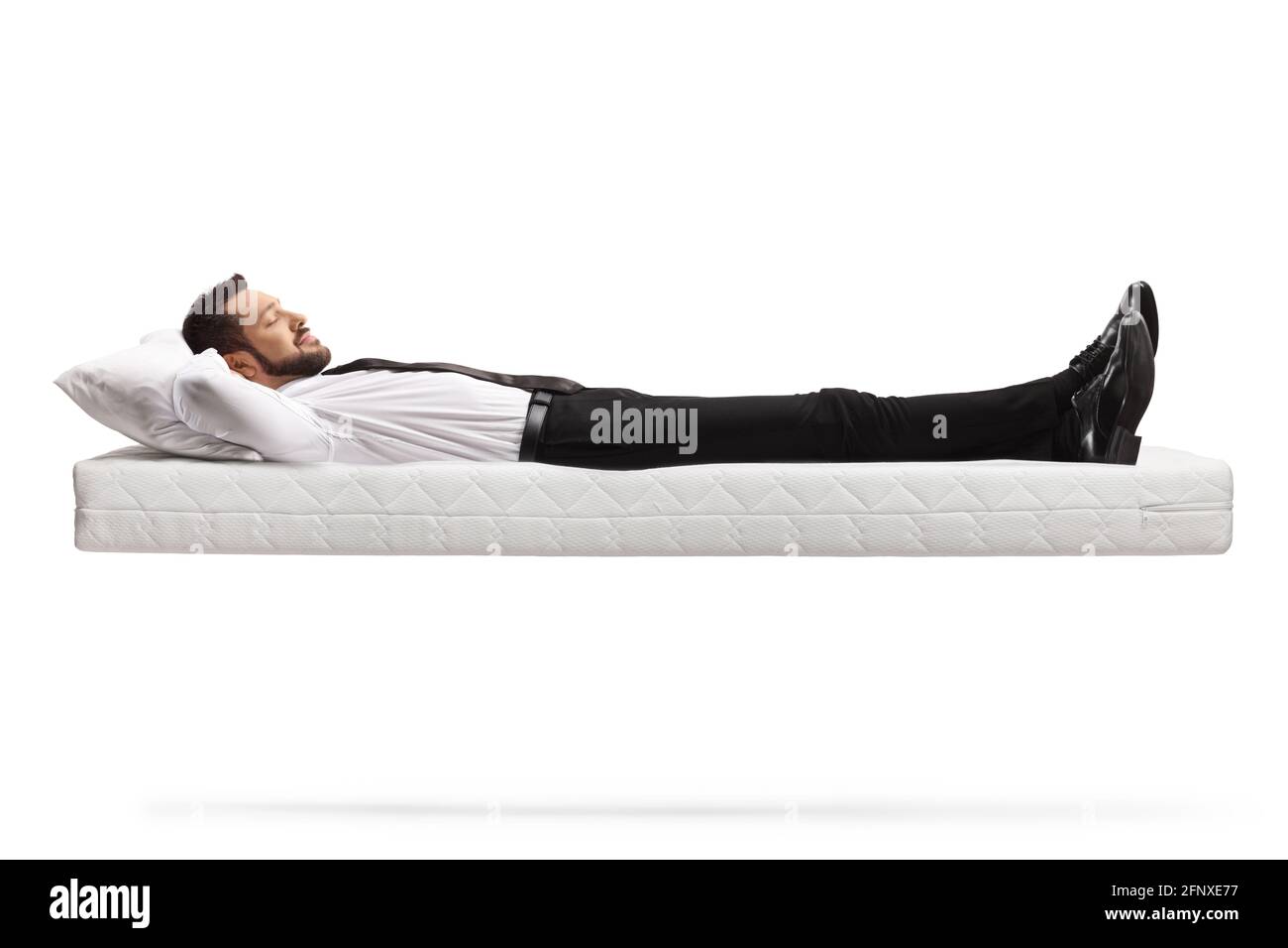 Man lying on a floating mattress with clothes and shoes isolated on ...