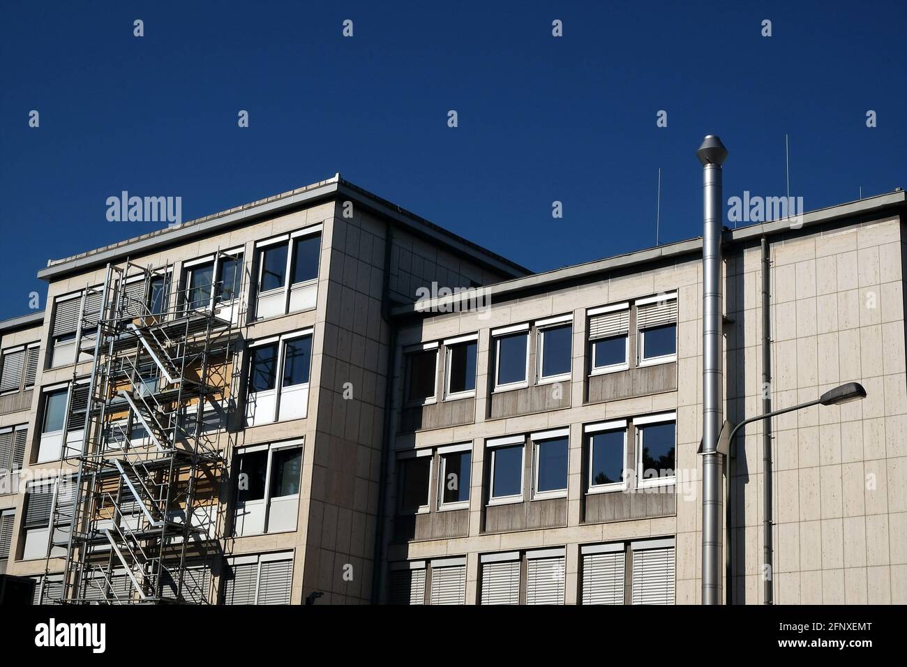 Short residential building with an exterior fire escape Stock Photo - Alamy