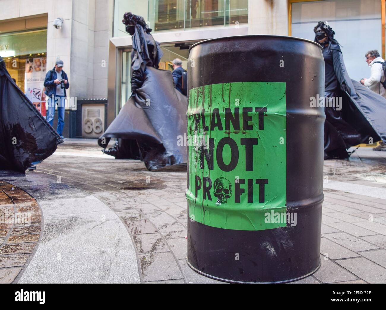 London, UK. 19th May, 2021. A barrel of fake oil seen outside Ineos ...