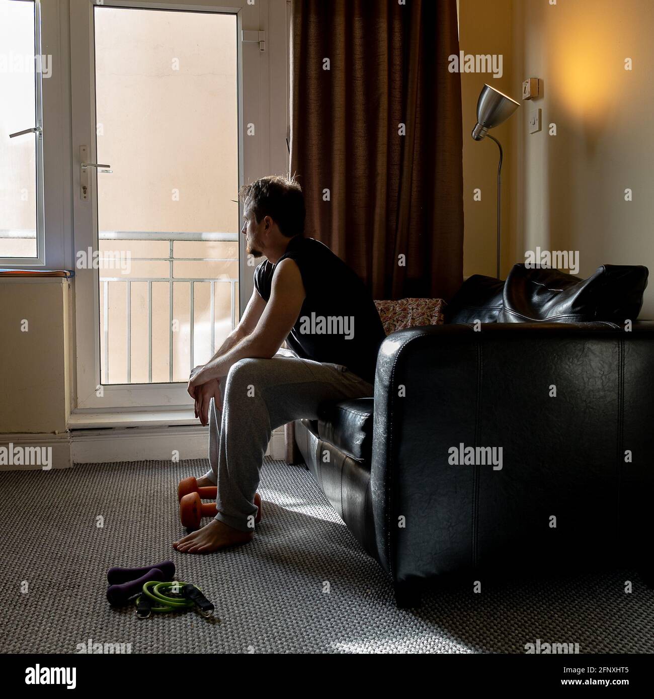 Bodybuilder sitting on sofa hi-res stock photography and images - Alamy