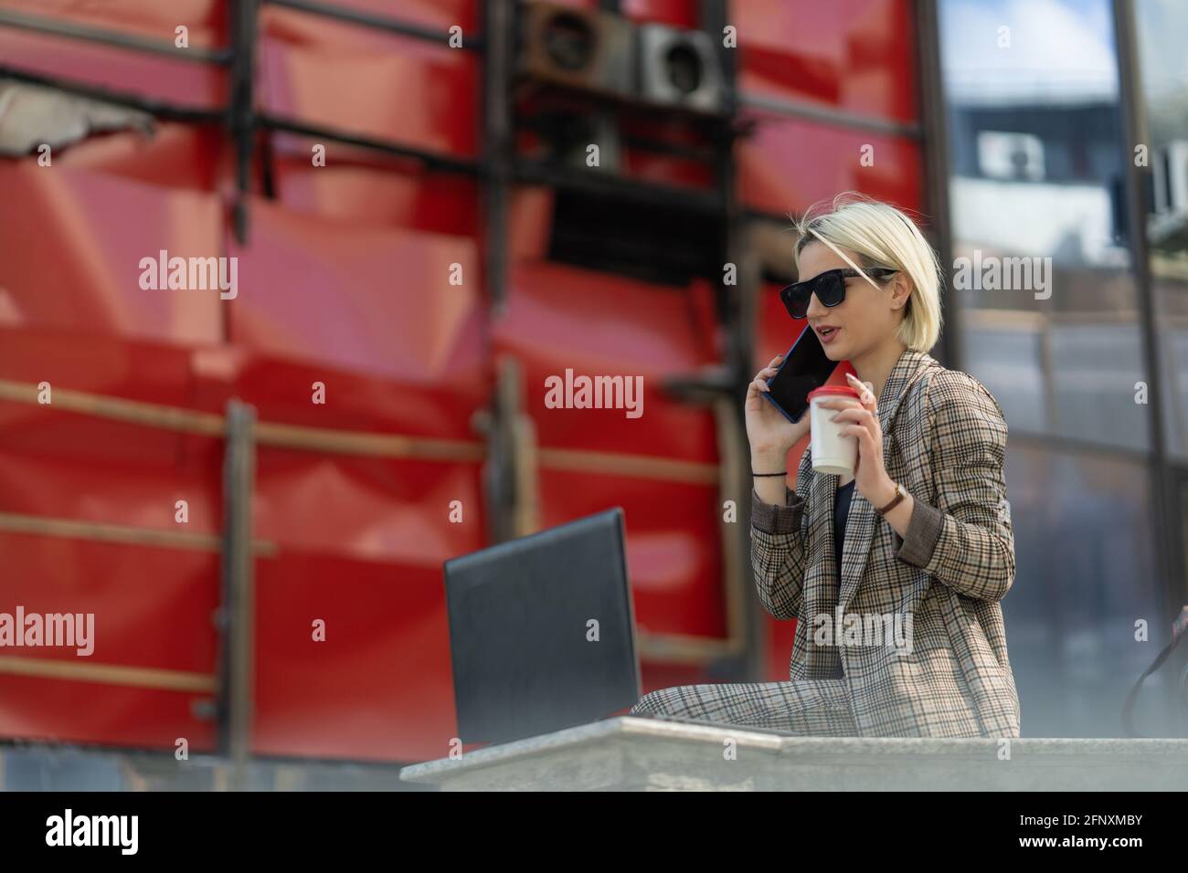Businesswoman is having a conversation about the plan while drinking ...