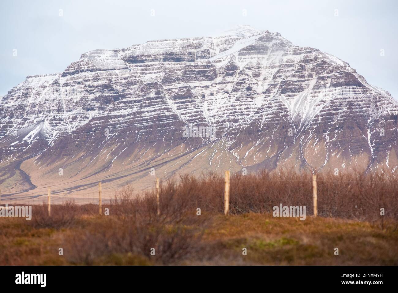 Colorful snow capped mountain showing off geological textures and ...