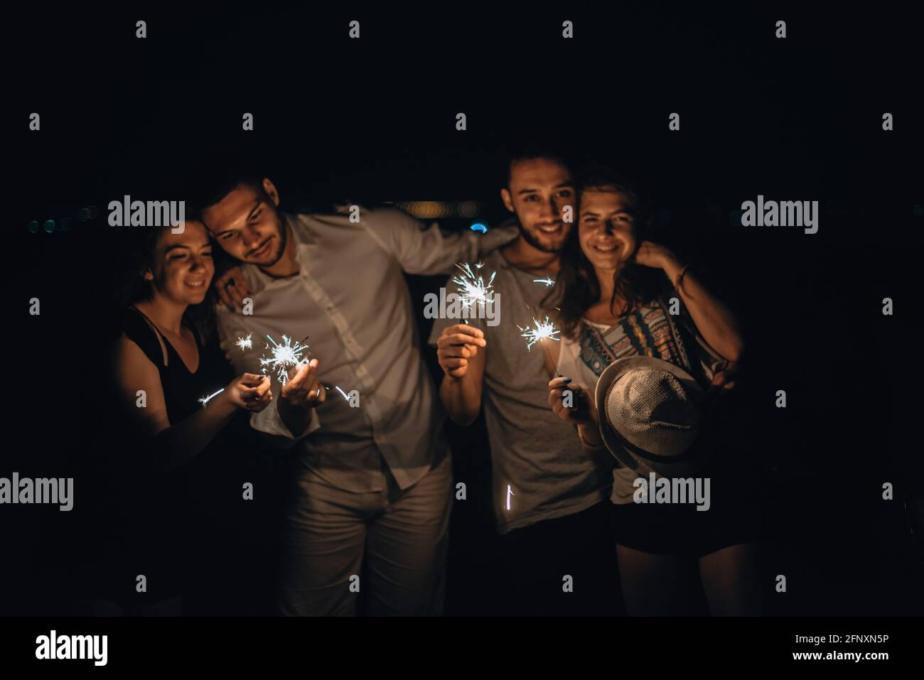 Bengal fire sticks, sparkling, burning, elegant classy ladies and ...