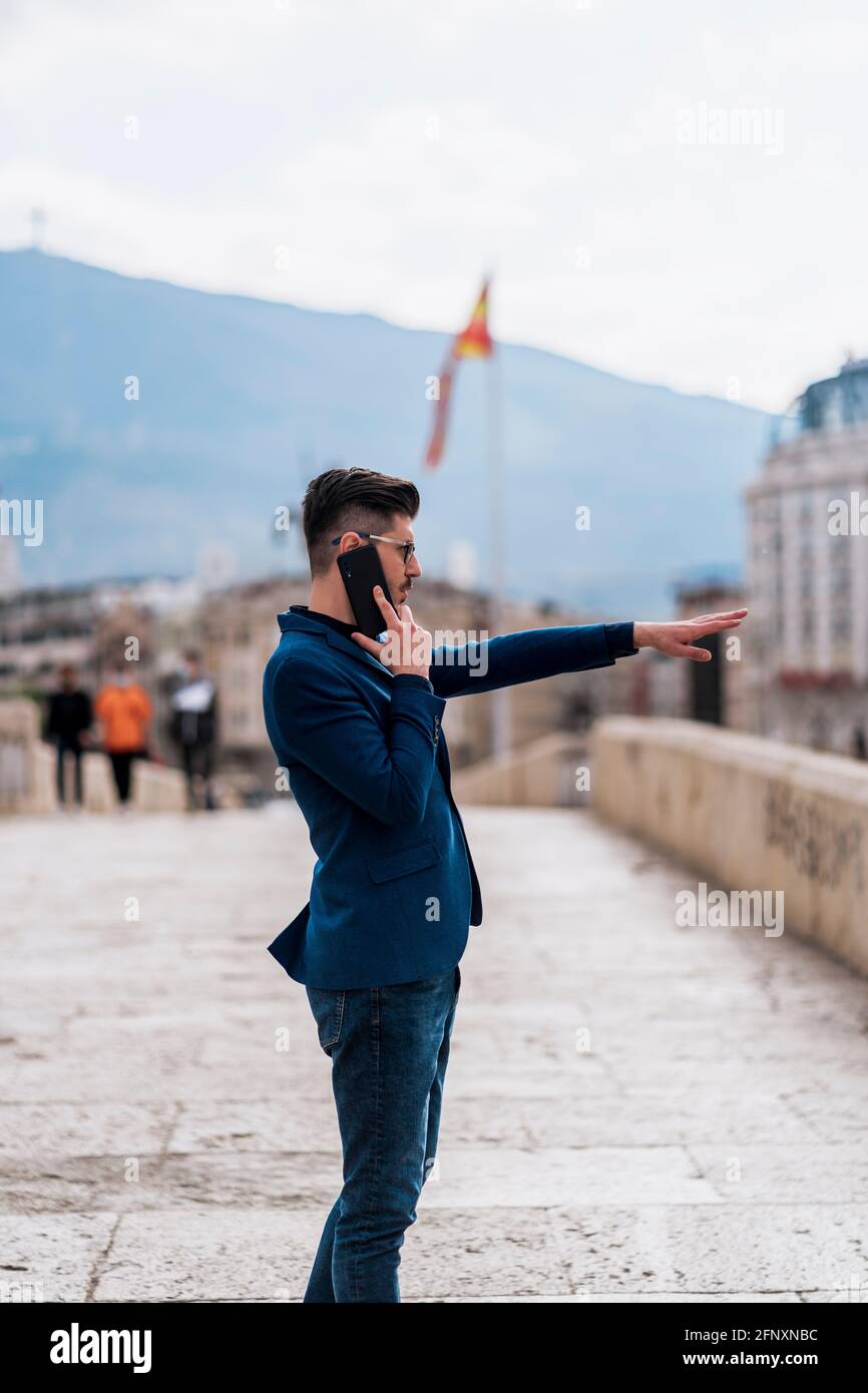 Lifestyle pointing bridge portrait hi-res stock photography and images ...