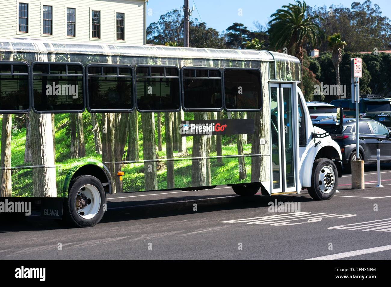 PresidiGo shuttle bus parked at bus stop in the San Francisco Presidio ...