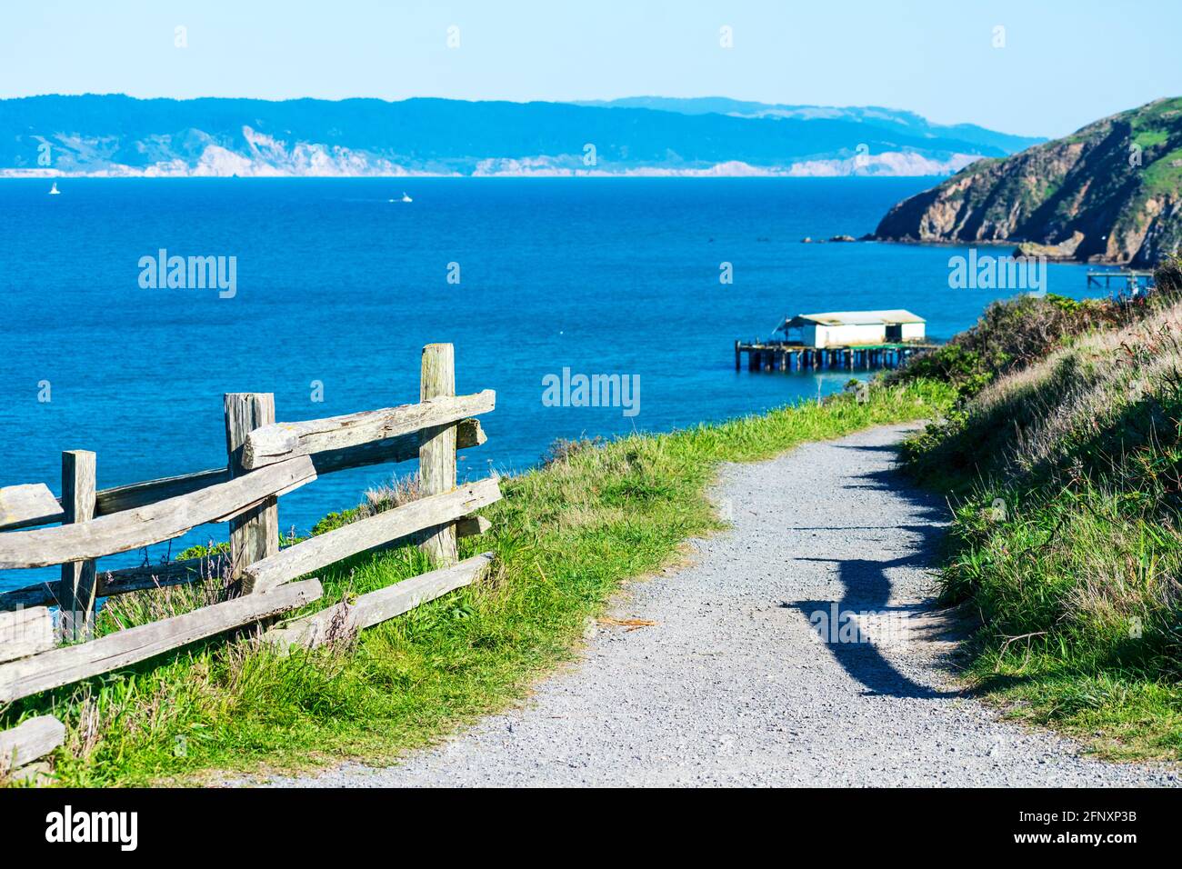 Unpaved hiking trail on cliff edge leading to lifeboat station at at ...