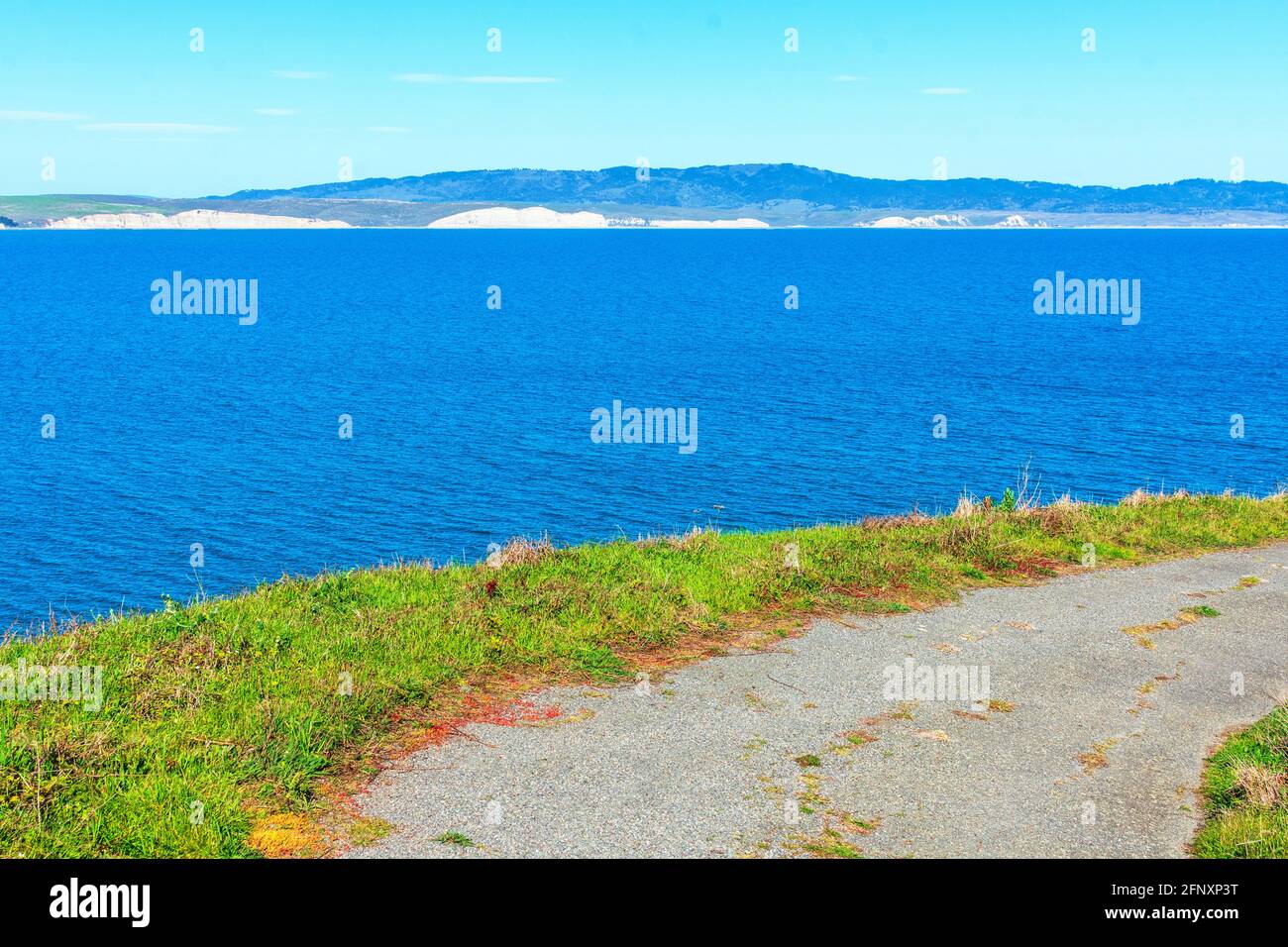 Paved hiking trail on cliff edge at Point Reyes Headlands. Scenic view ...