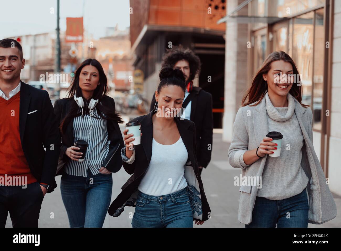 Diverse male female colleagues walking hi-res stock photography and ...
