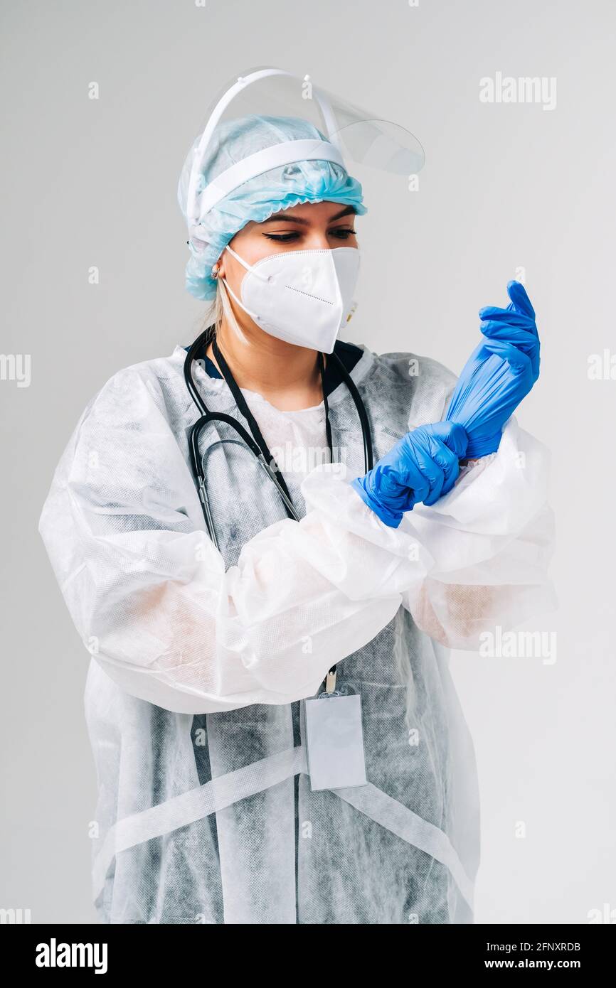 Young woman nurse hospital worker in medical protective mask, gloves ...