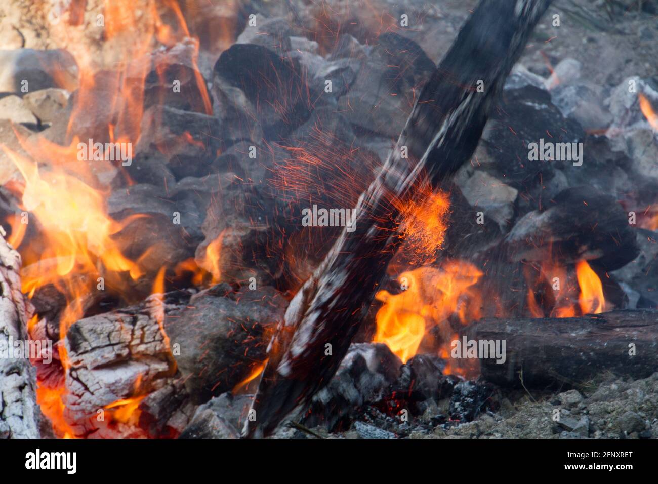 Stones in the fire for furnace underground Stock Photo - Alamy