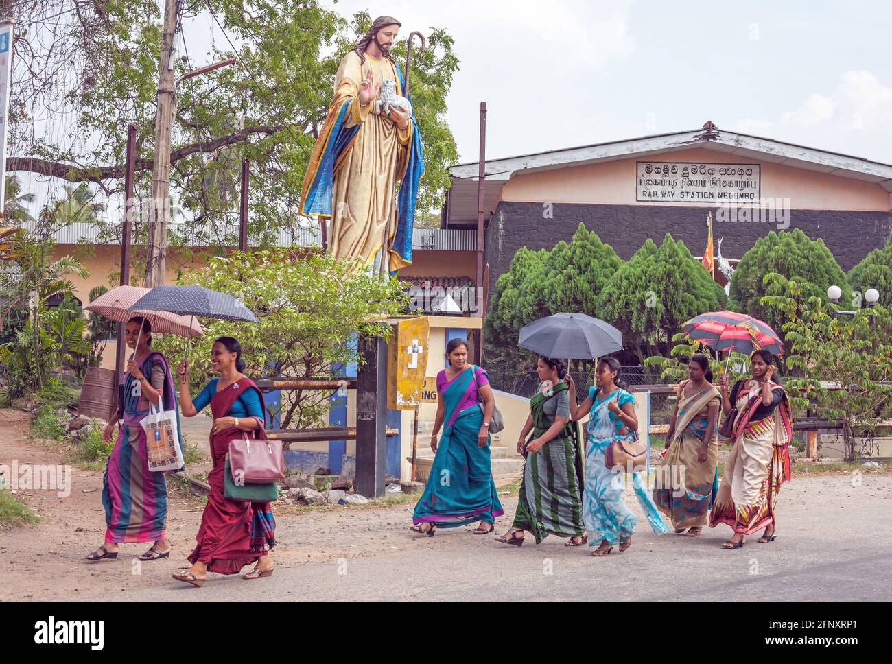 Large statue of Jesus giving hand gesture looking down over seven Sri ...